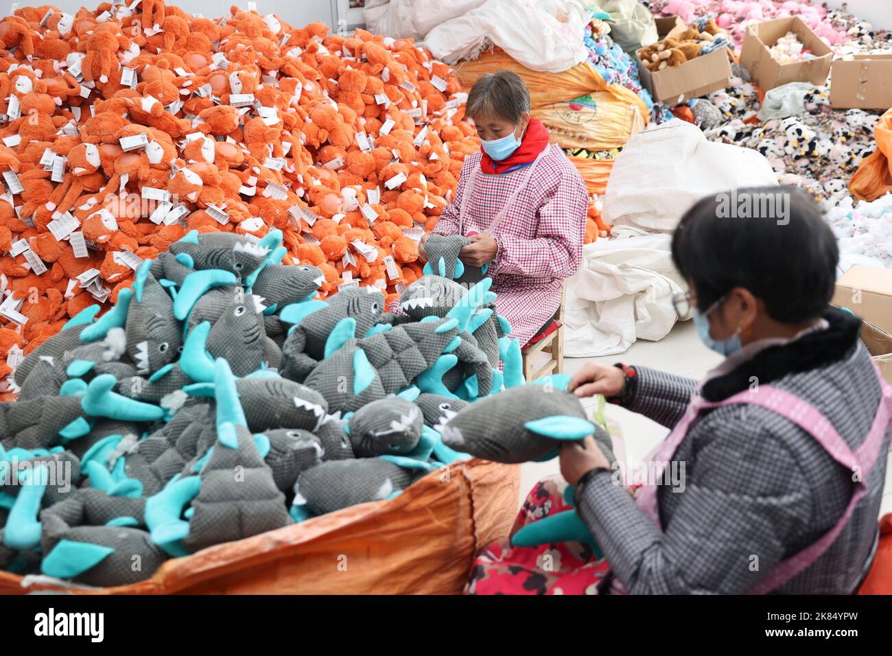 LIANYUNGANG, CHINA - OCTOBER 21, 2022 - Employees of a toy company rush ...
