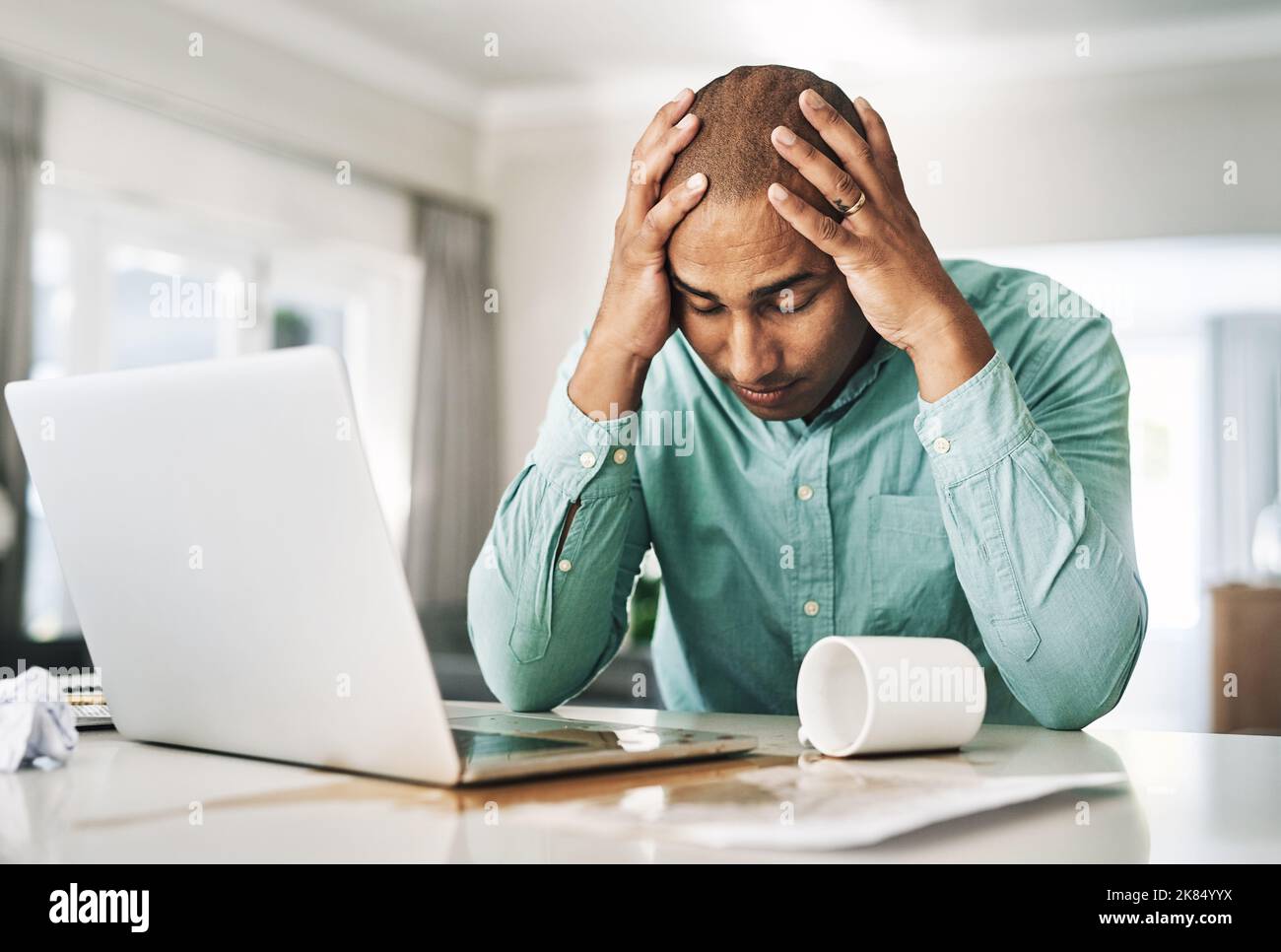 All my work was on there. a young businessman looking sad at home Stock ...