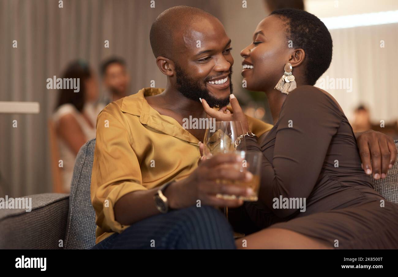 Alcohol makes her really flirty. a happy young couple sitting together ...