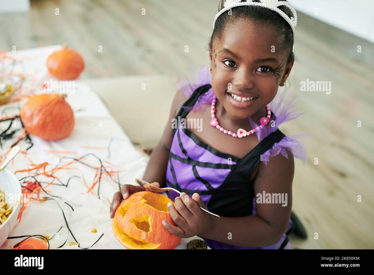 My pumpkins all clean now. a little girl cleaning a pumpkin at a party ...