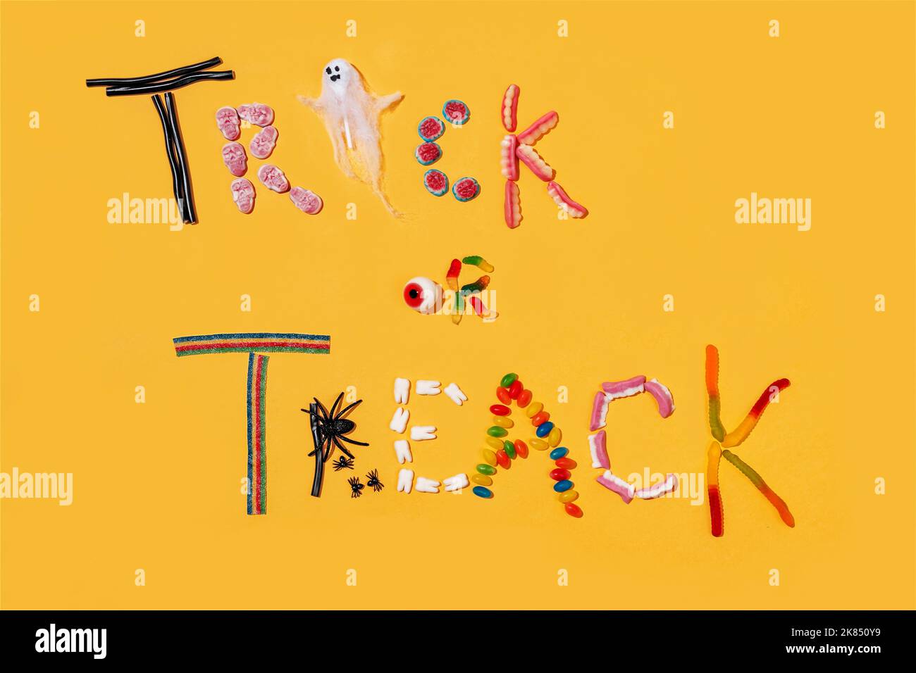 Trick or treat. Sweet candy on yellow background. Halloween party Stock ...