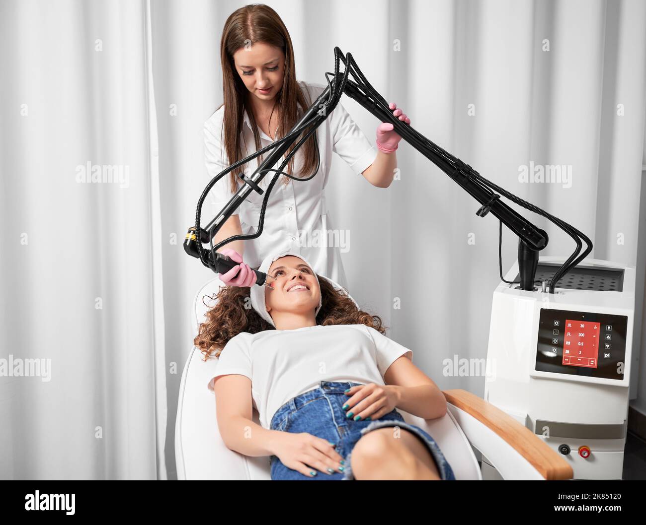 Visiting beautician to treat post-traumatic acne scars. Female ...