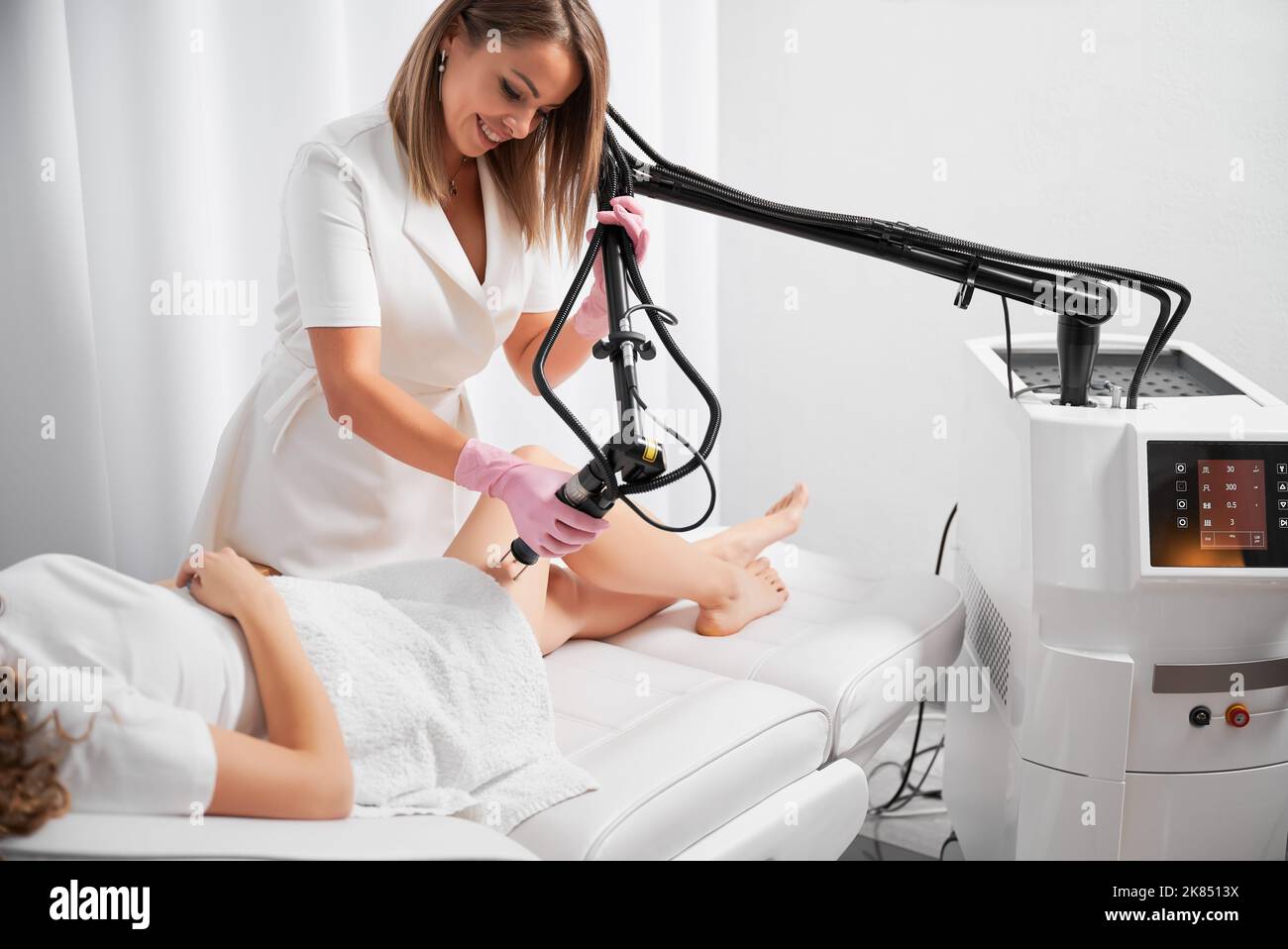 Dermatologist working with modern laser device for polishing and ...