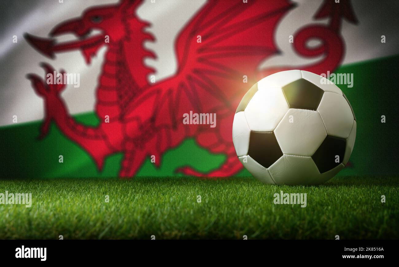 Wales national team composition with classic ball on grass and flag in ...