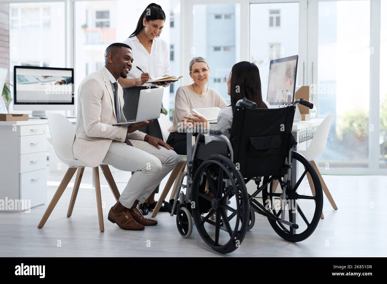 Discussing the way forward. Full length shot of a group of diverse ...