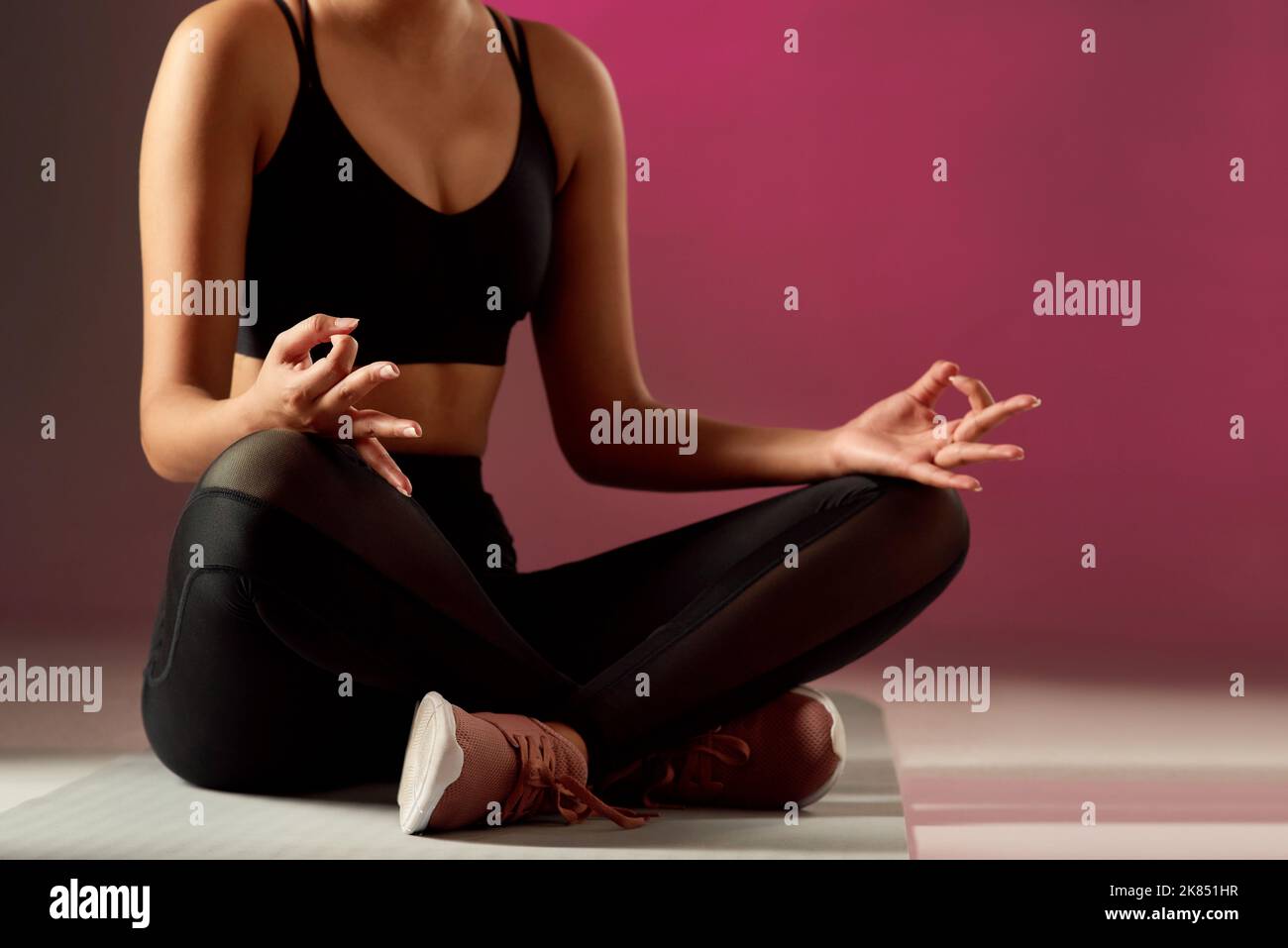Getting into zen mode. Studio shot of an unrecognisable woman ...