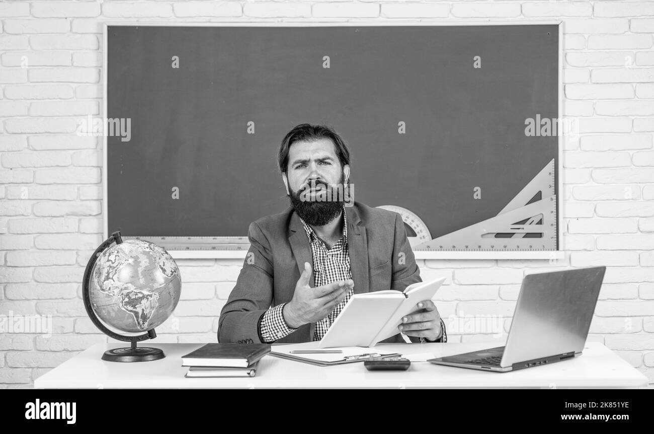 informal education. male student sit in school classroom on lesson with ...