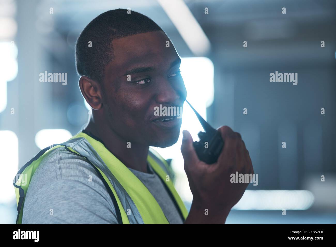 Can you bring the forklift please. a handsome young contractor standing ...