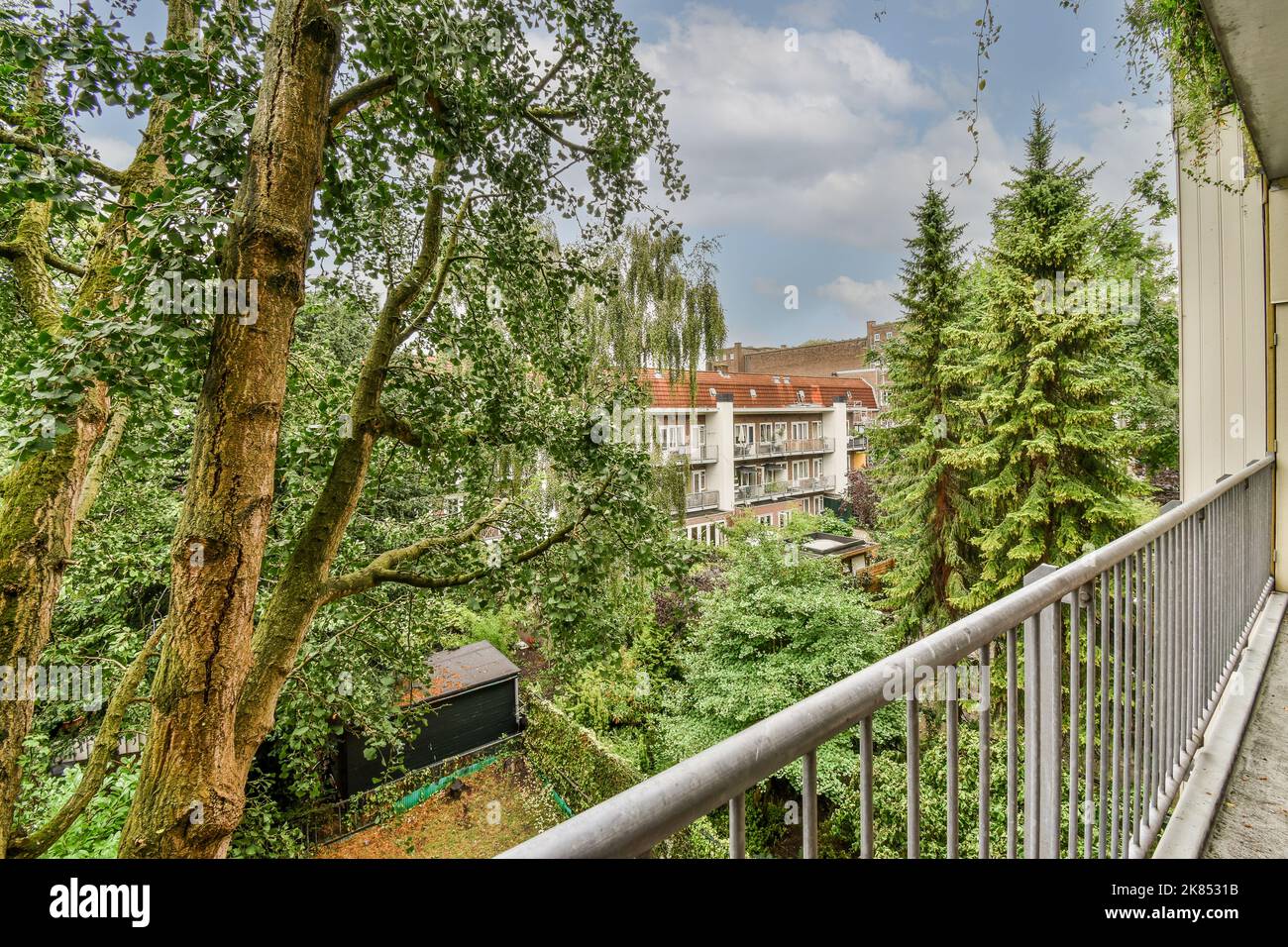 Sitting area in balcony with comfortable furniture around beautiful ...