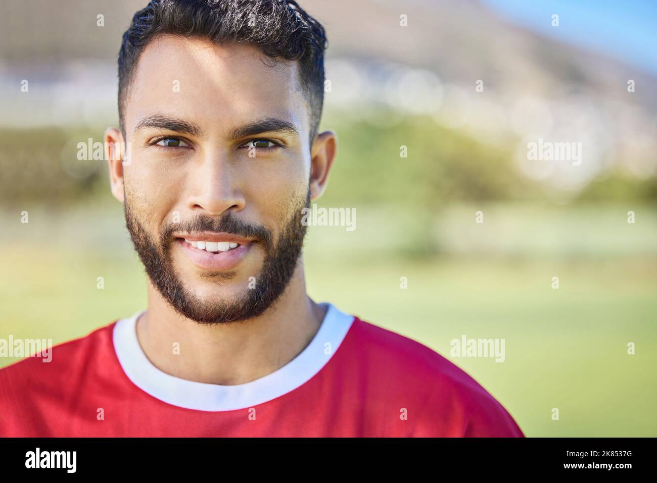 Soccer player, portrait and man on soccer field happy, smile and ...