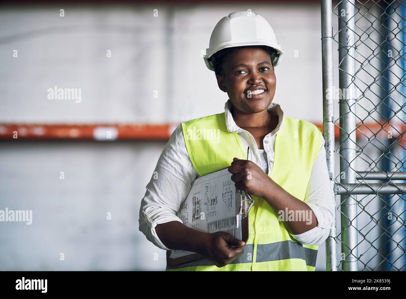 Safety is everything in this field. Portrait of a confident young woman ...