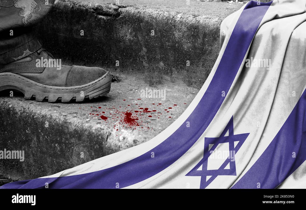 The leg of the military stands on the step next to the flag of Israel ...