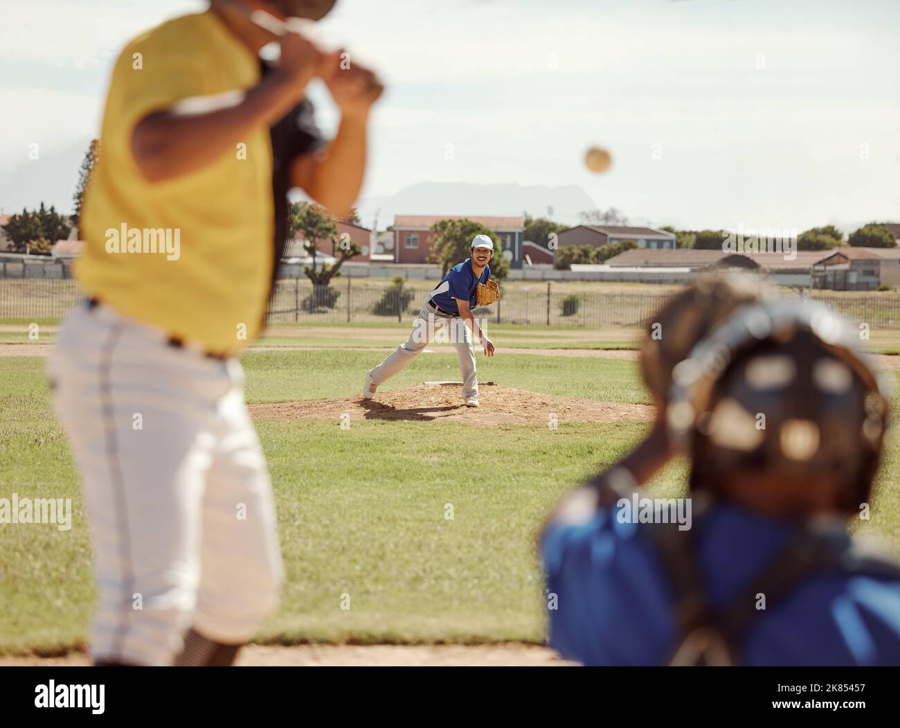 Baseball, bat and man ready for a fast ball on a baseball field in a ...