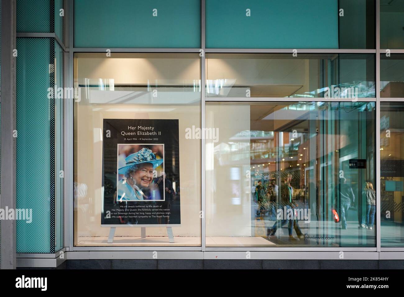 A portrait of Britain's Queen Elizabeth is seen in a window, following ...