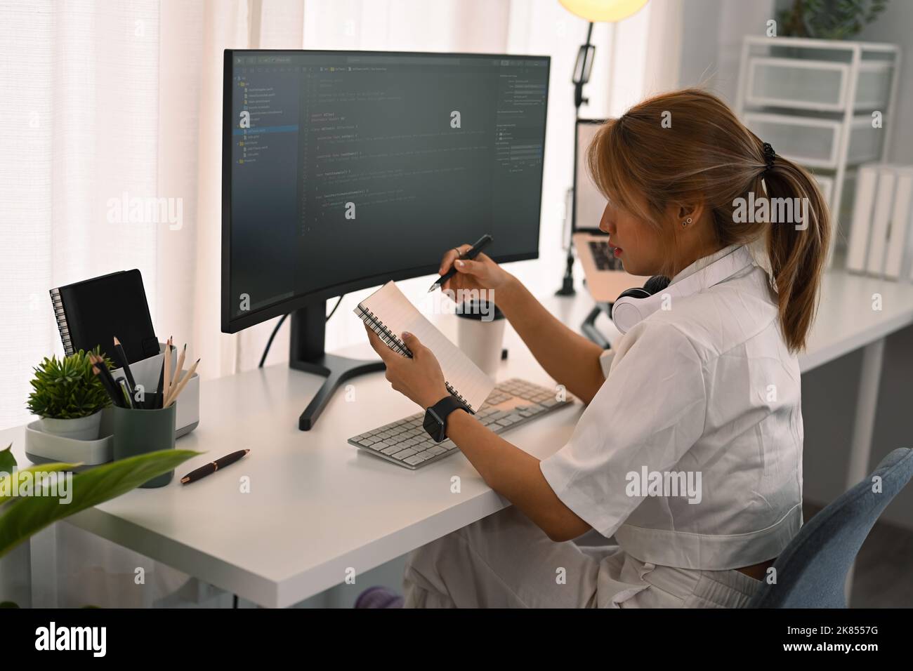 Side view of professional software developer working with coded data in ...