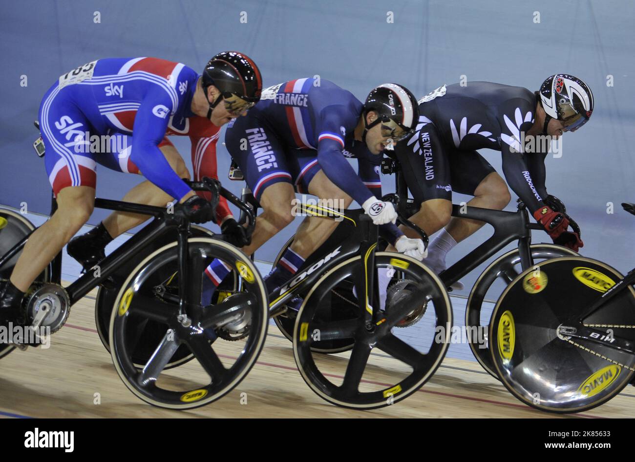 Great Britain's Sir Chris Hoy is lead by France's Mickael Bourgain and ...