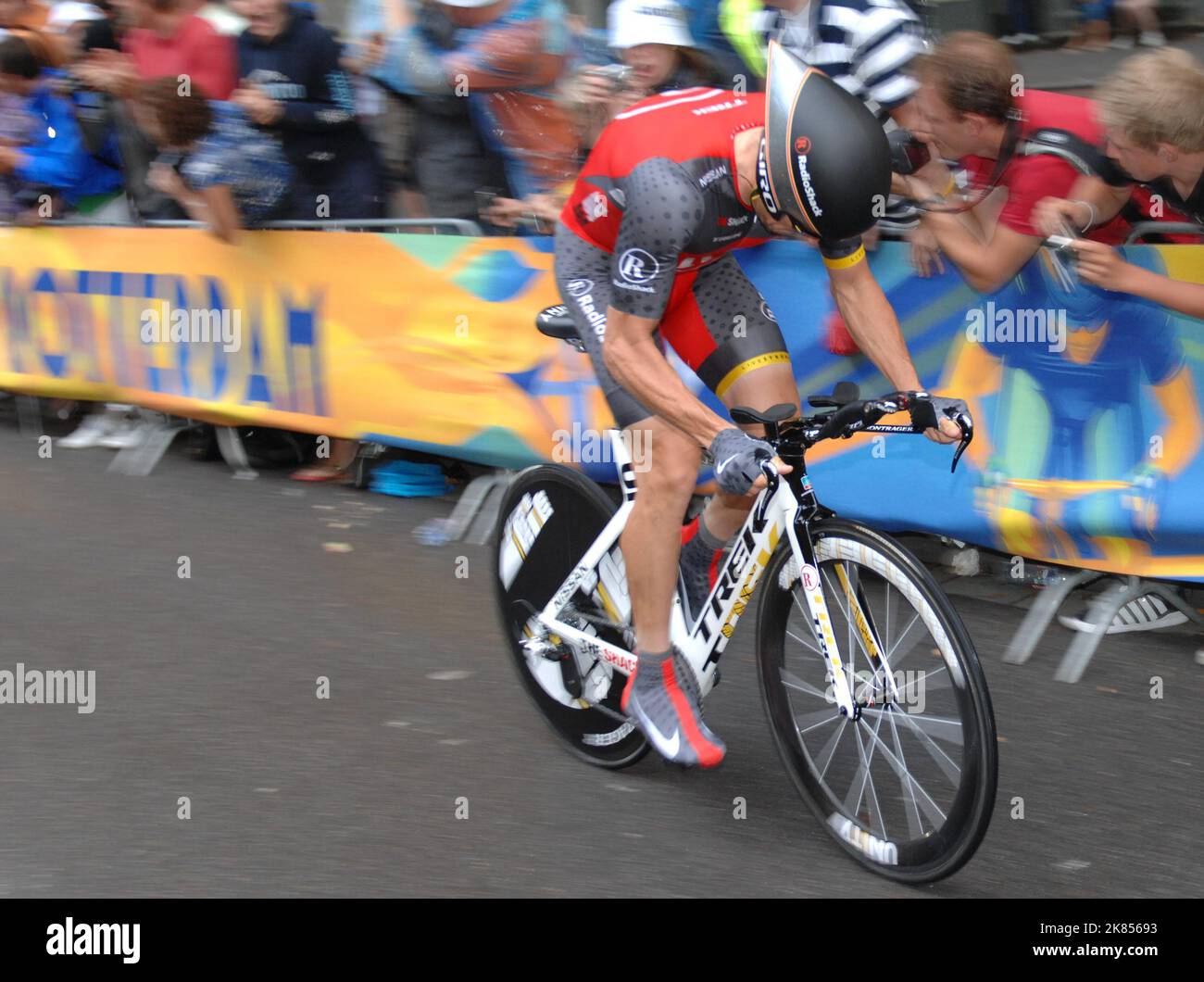 Lance Armstrong races to the finish line in the first day's time trial ...