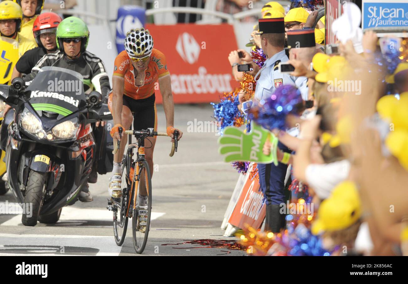 Samuel sanchez crosses the stage 9 finish line to end up 8th overall ...