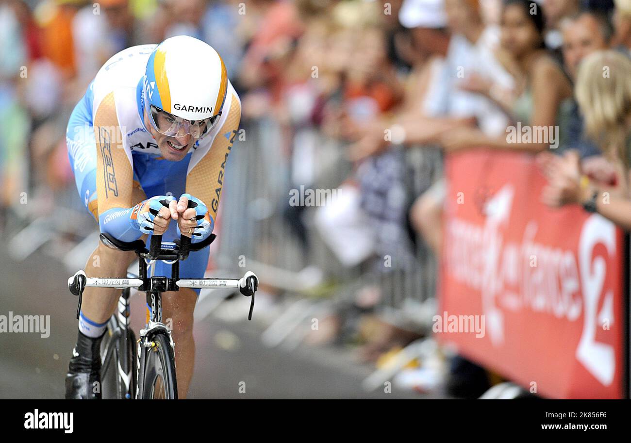 David Millar races to the finish line in the first day's time trial ...