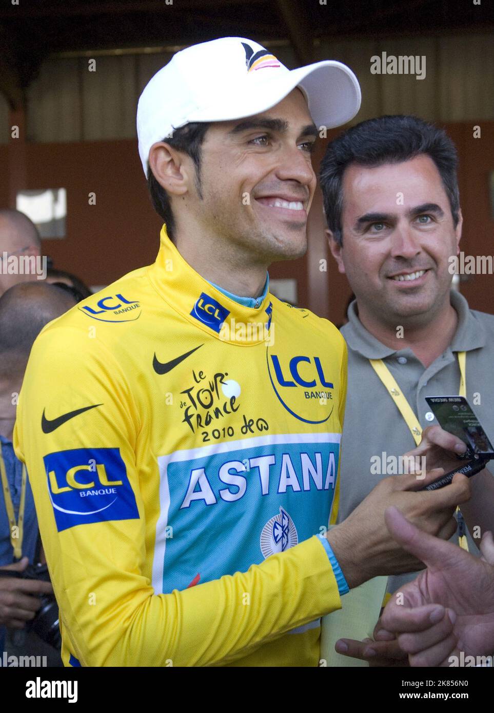 Team Astana's Alberto Contador celebrates retaining the yellow jersey ...
