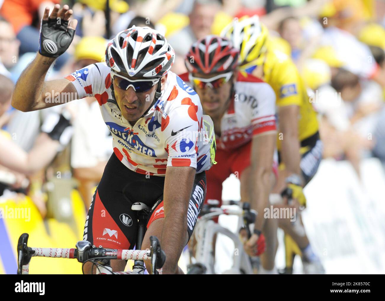 Team Quick Step's Jerome Pineau reacts as he crosses the finish line in ...