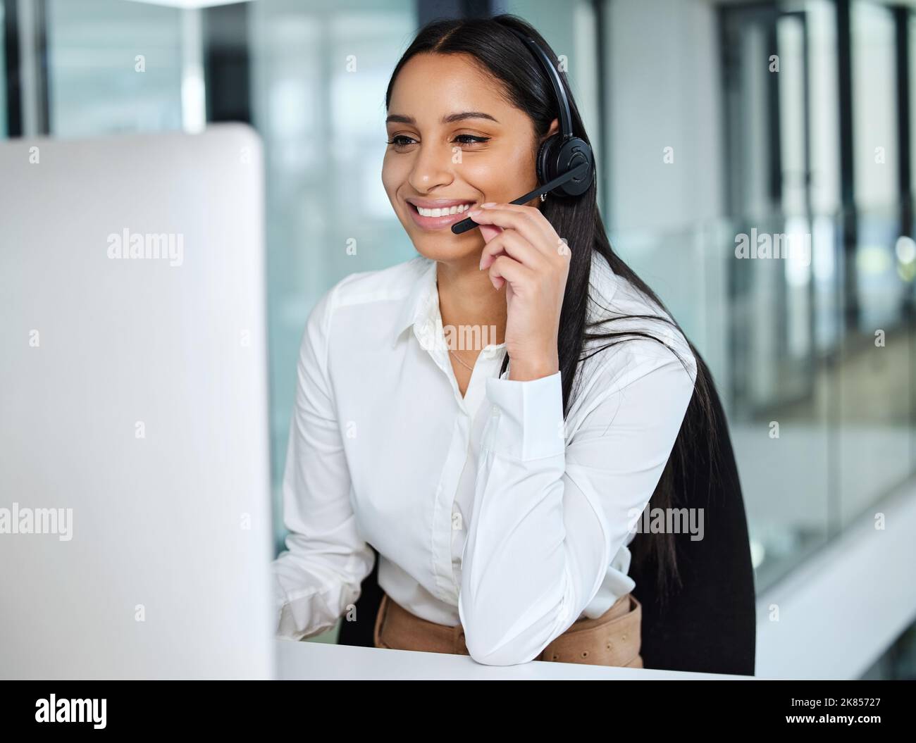 Let me pull up your account details. an attractive young call centre ...