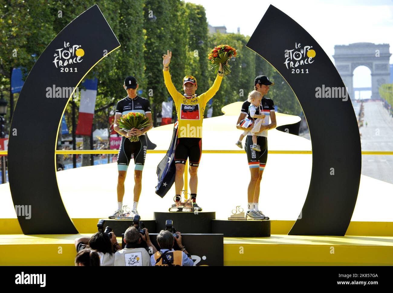 BMC Racing Team's Cadel Evans celebrates with Team Leopard Trek's Frank ...