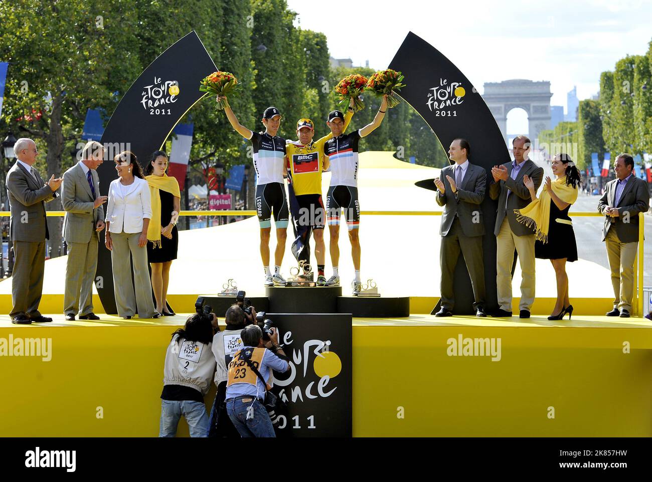 BMC Racing Team's Cadel Evans celebrates with Team Leopard Trek's Frank ...