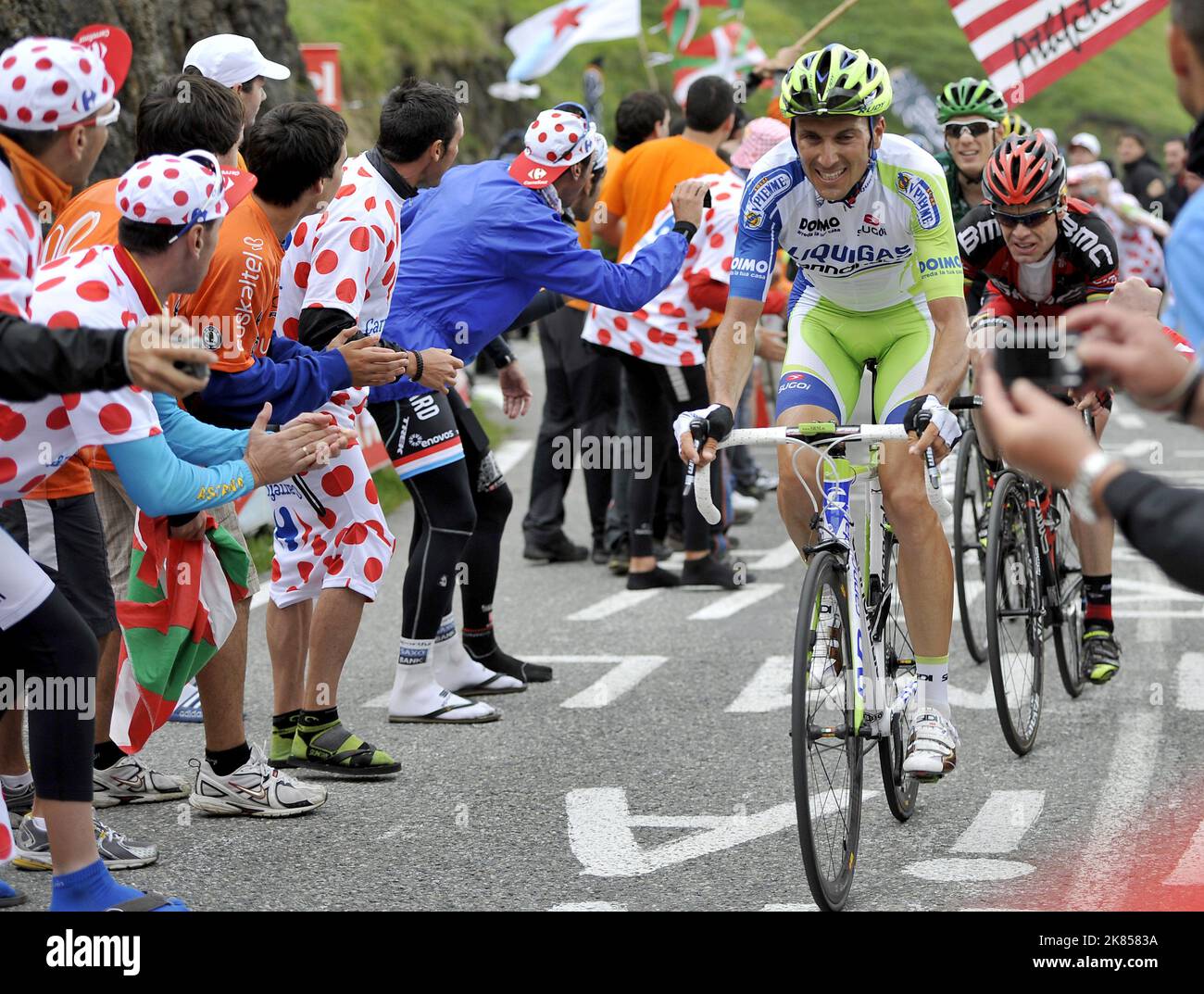 Liquigas - Cannondale's Iban Basso (L) and BMC Racing Team's Cadle ...
