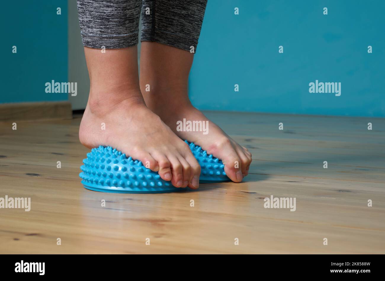 Female feet touching massage ball Stock Photo - Alamy