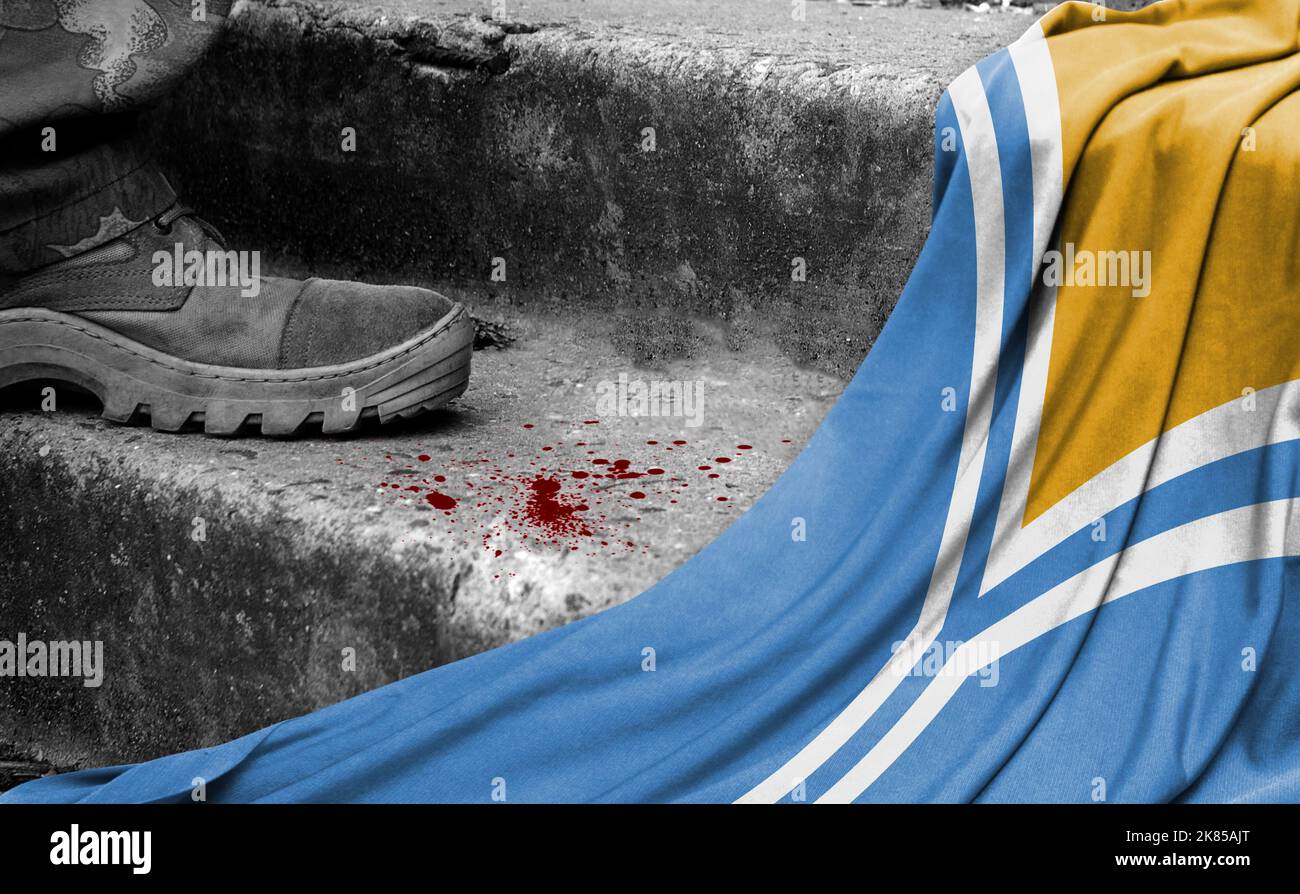 The leg of the military stands on the step next to the flag of Tuva ...
