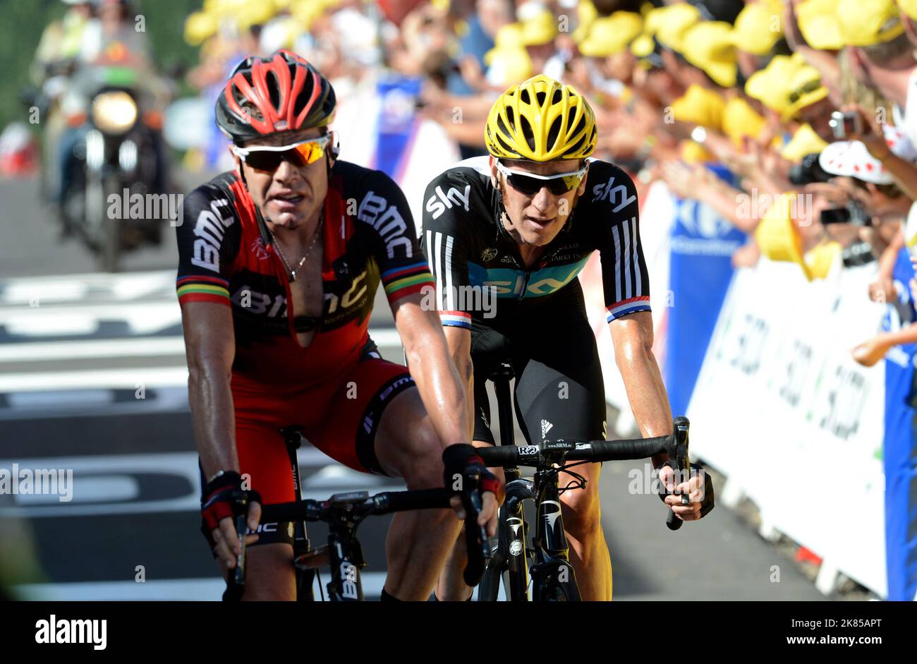 Cadel Evans of team BMC crosss the finish line in 2nd place in front of Bradley Wiggins of team ...