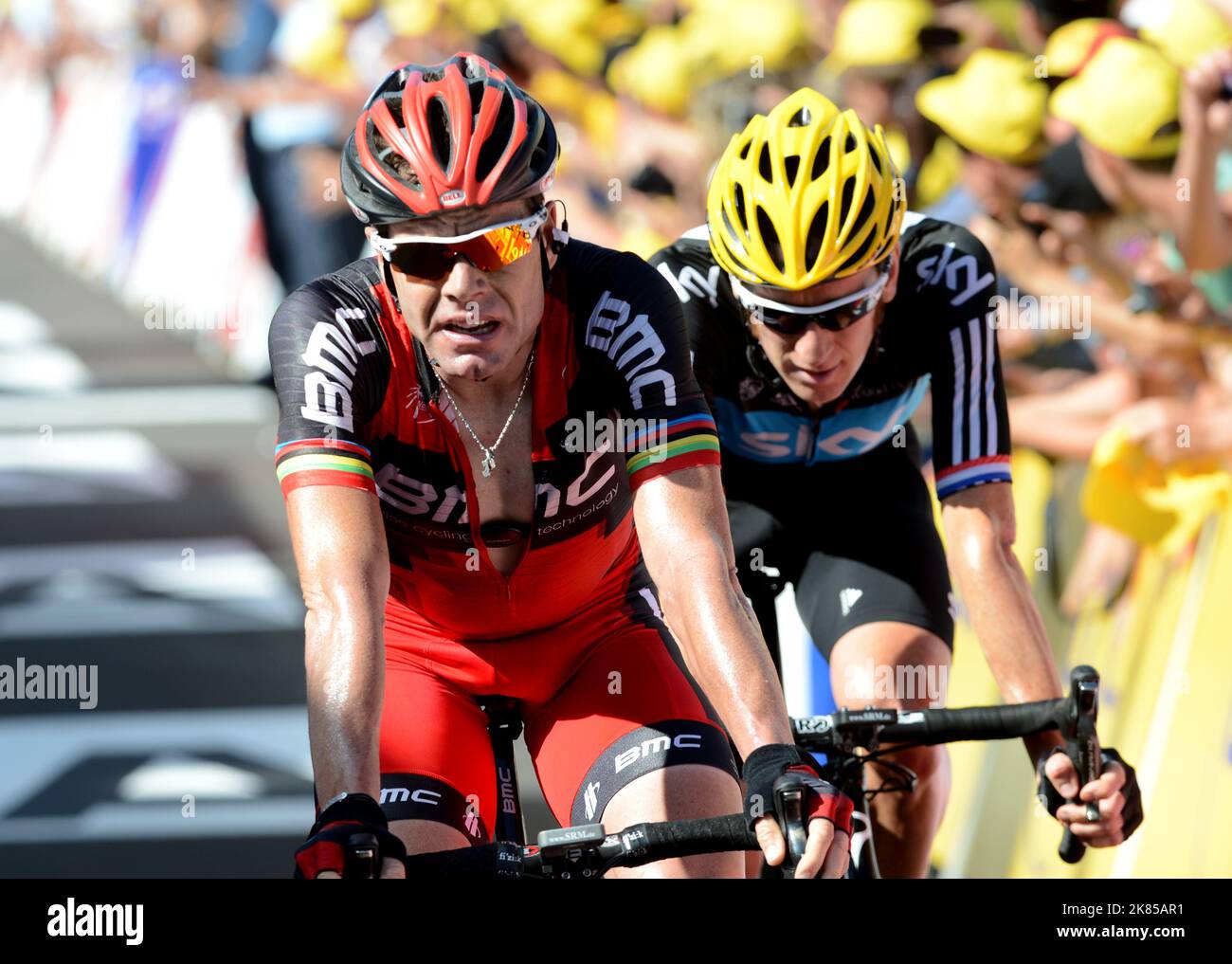 Cadel Evans of team BMC crosses the finish line in 2nd place in front ...