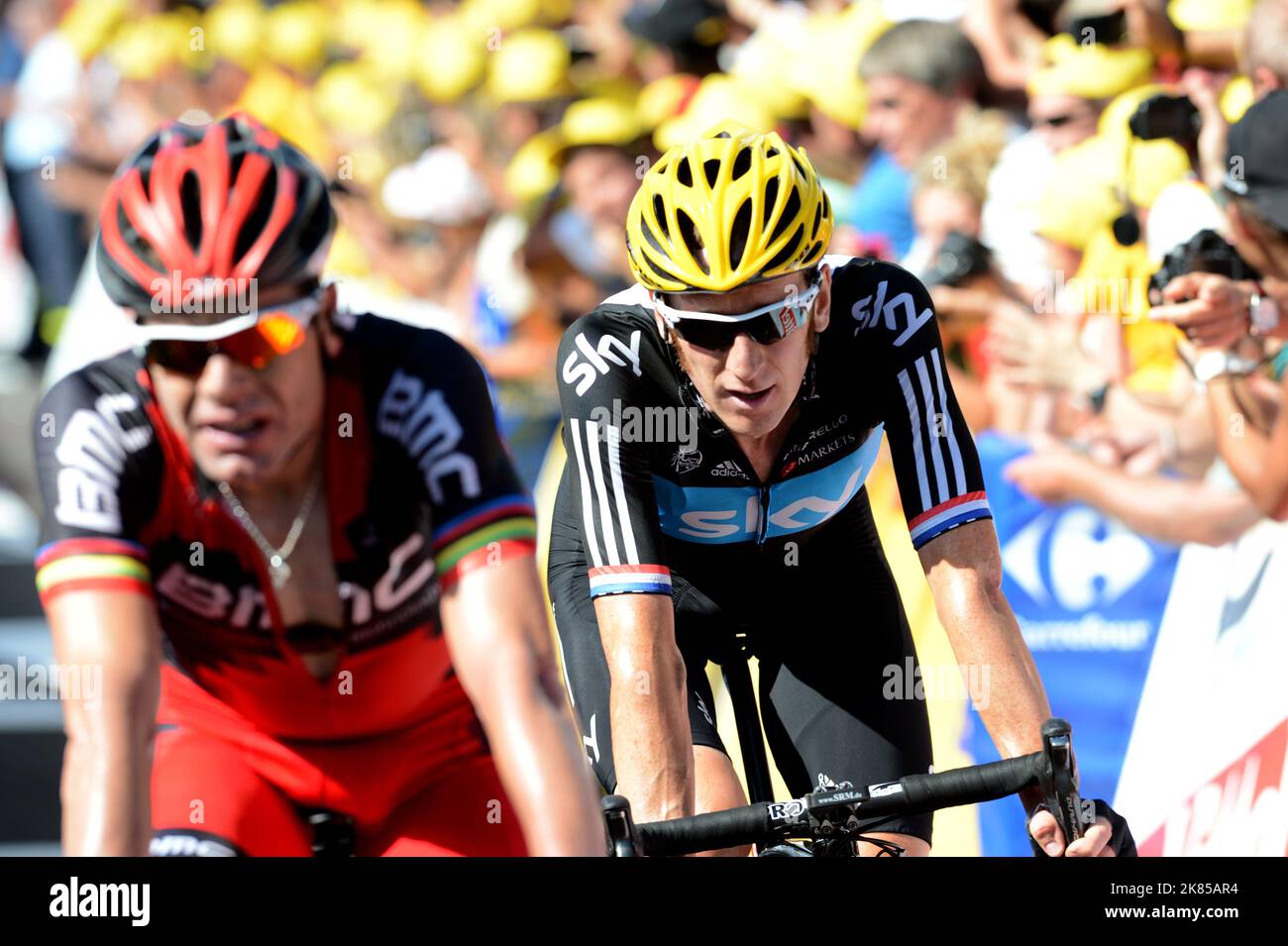 Cadel Evans of team BMC crosses the finish line in 2nd place in front ...