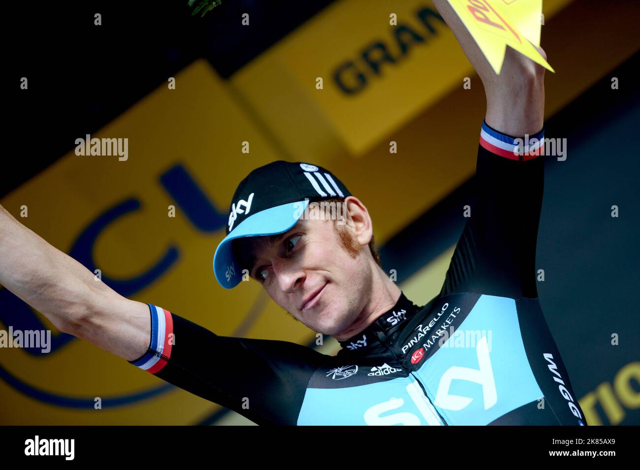Bradley Wiggins of team Sky Procycling on the podium after winning ...