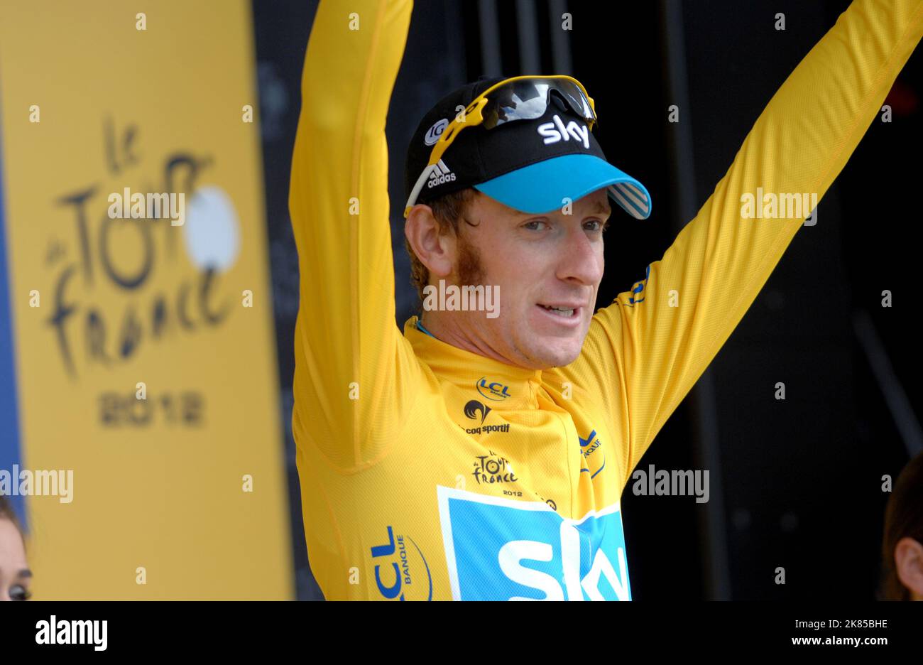 Bradley Wiggins team Sky crossed the finish line in 12th position retaining his lead and ...