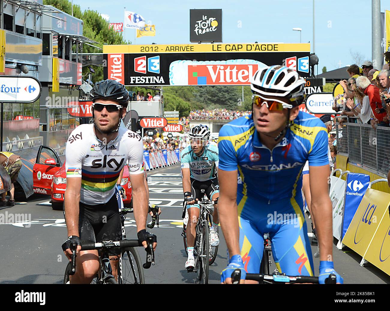 Andry Grivko (team Astana) crosses the finish line and behind him Mark ...