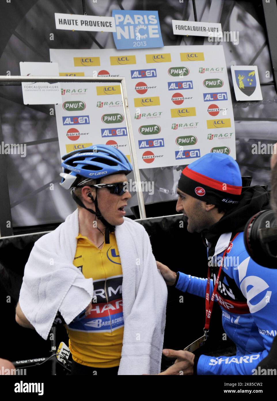 Team Garmin Sharp's Andrew Talansky arrives at the podium draped in a ...