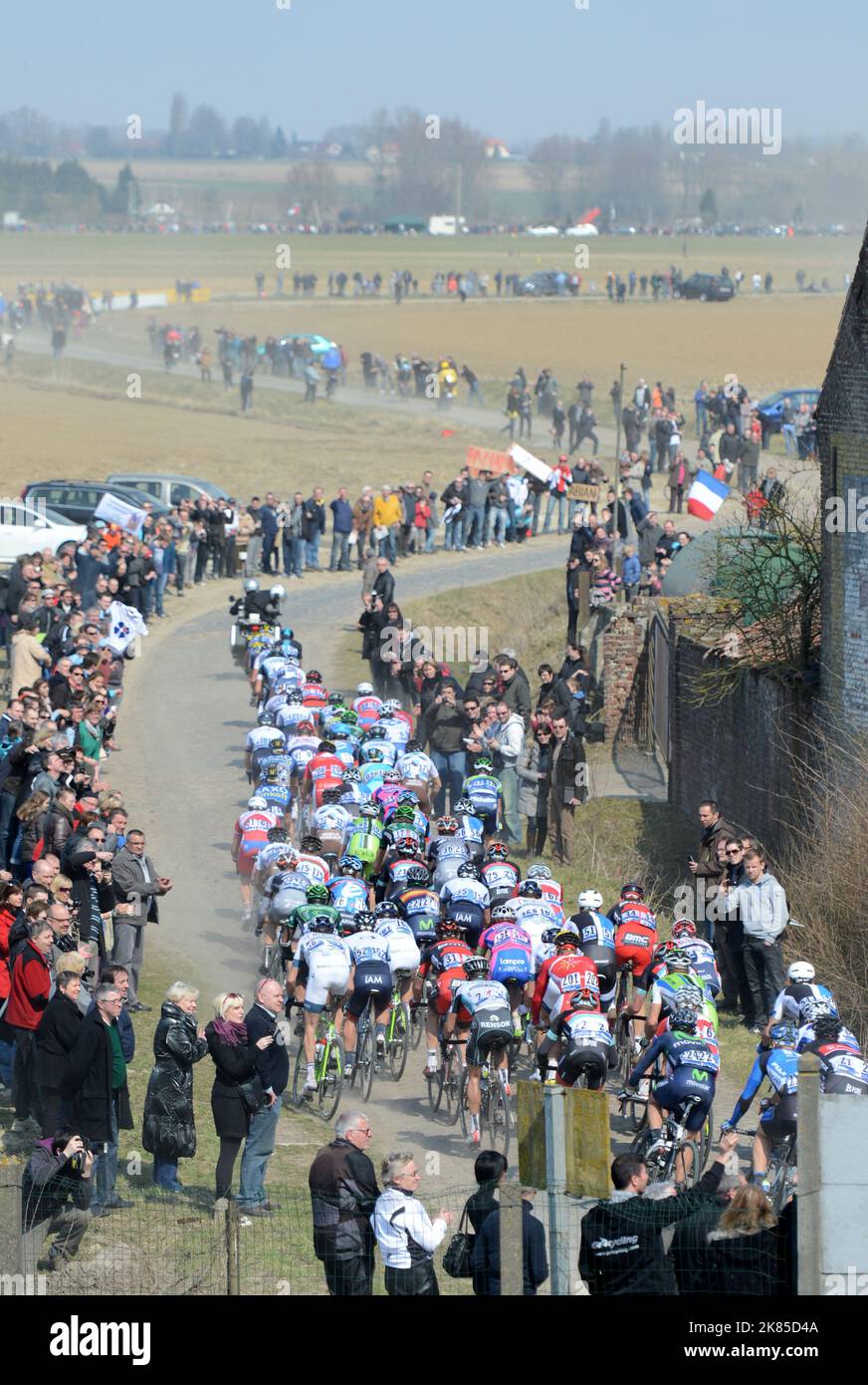 The peloton rides through the French countryside near Orchies in a ...
