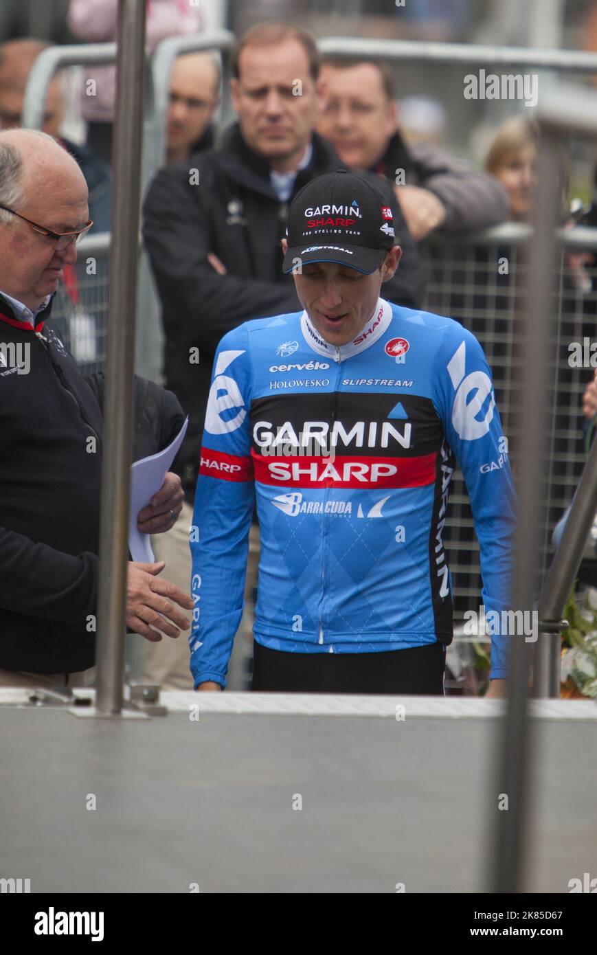 Daniel Martin (IRL), team Garmin Sharp walks up the steps of the podium ...