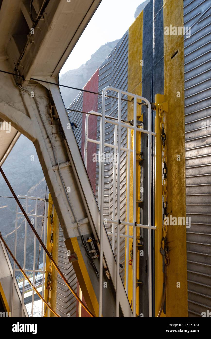 Santorini, Greece. 2022. Heavy metal double loading ramps opening on a ...