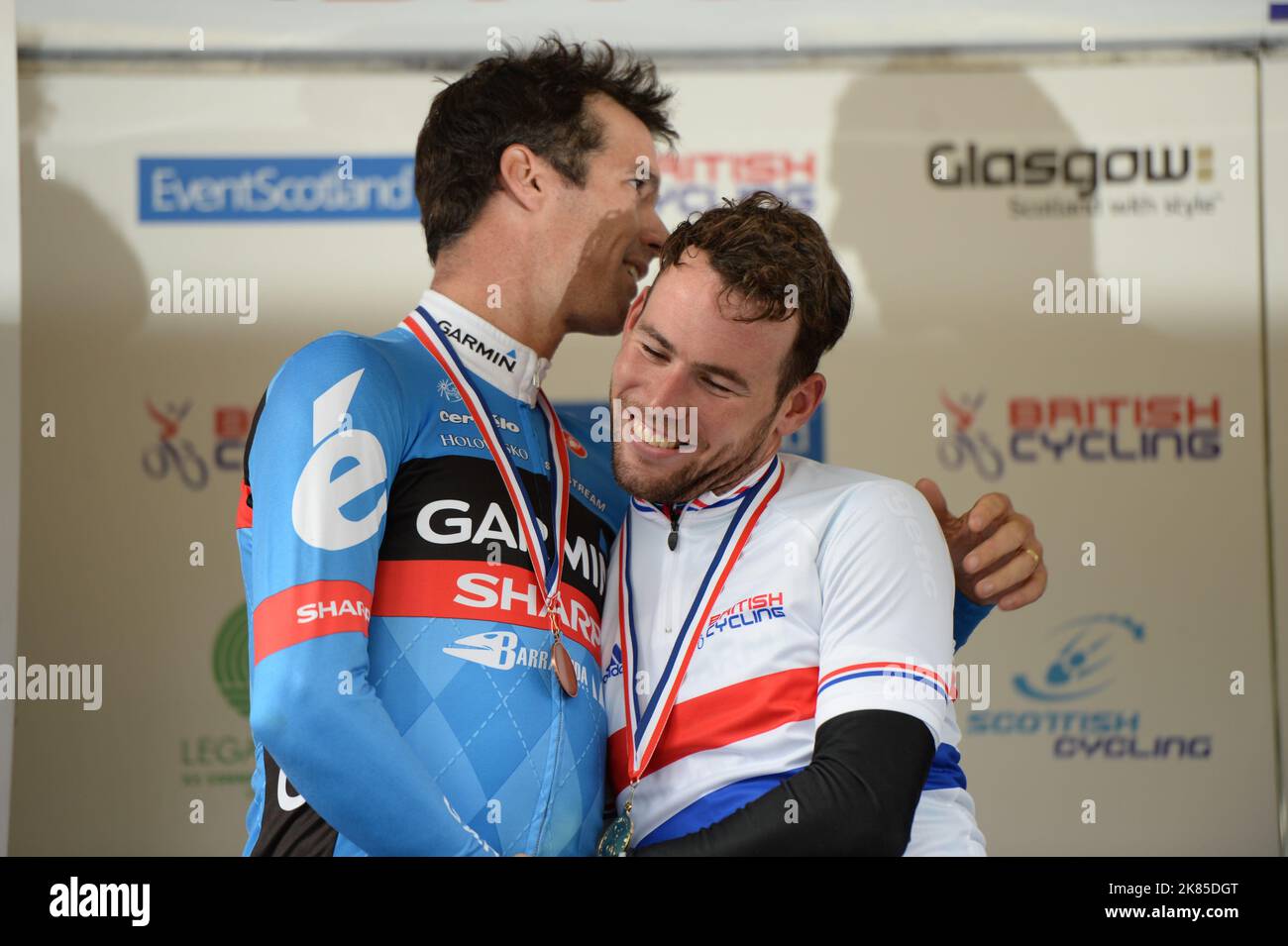Mark Cavendish alongside placed David Millar (left) on to the podium ...