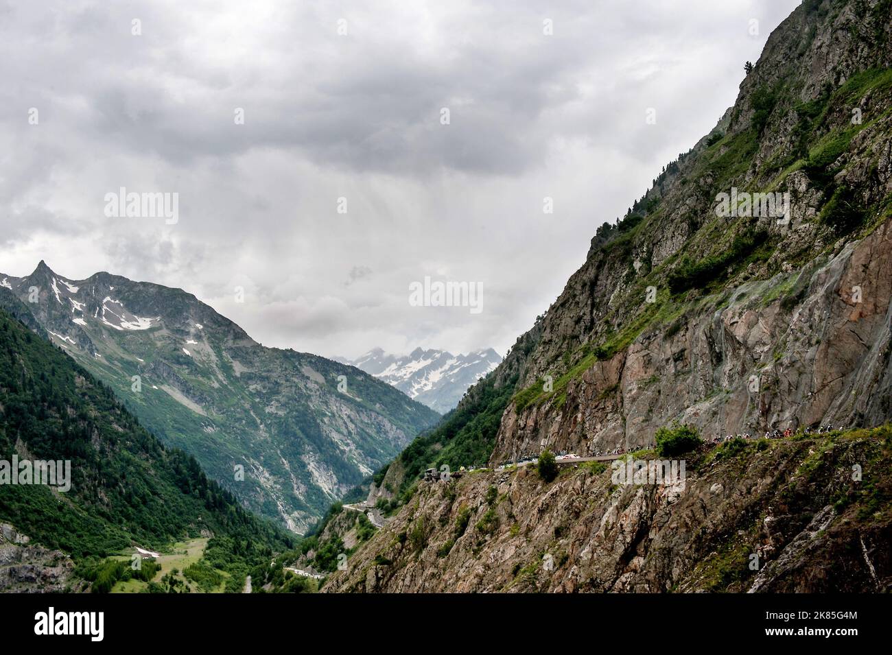 The peloton ride over the first mountain pass the Col du Glandon ...