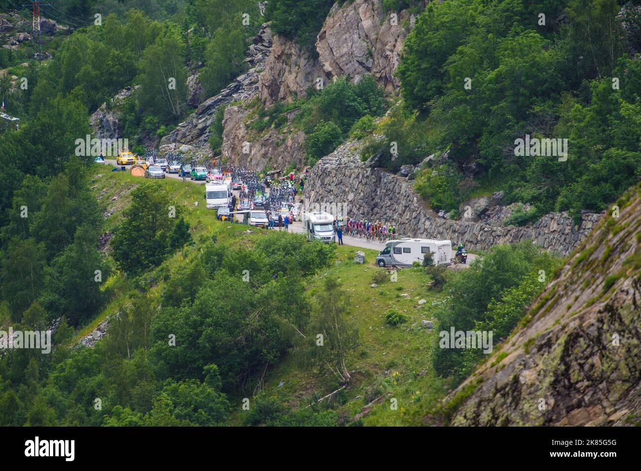 The peloton ride over the first mountain pass the Col du Glandon ...