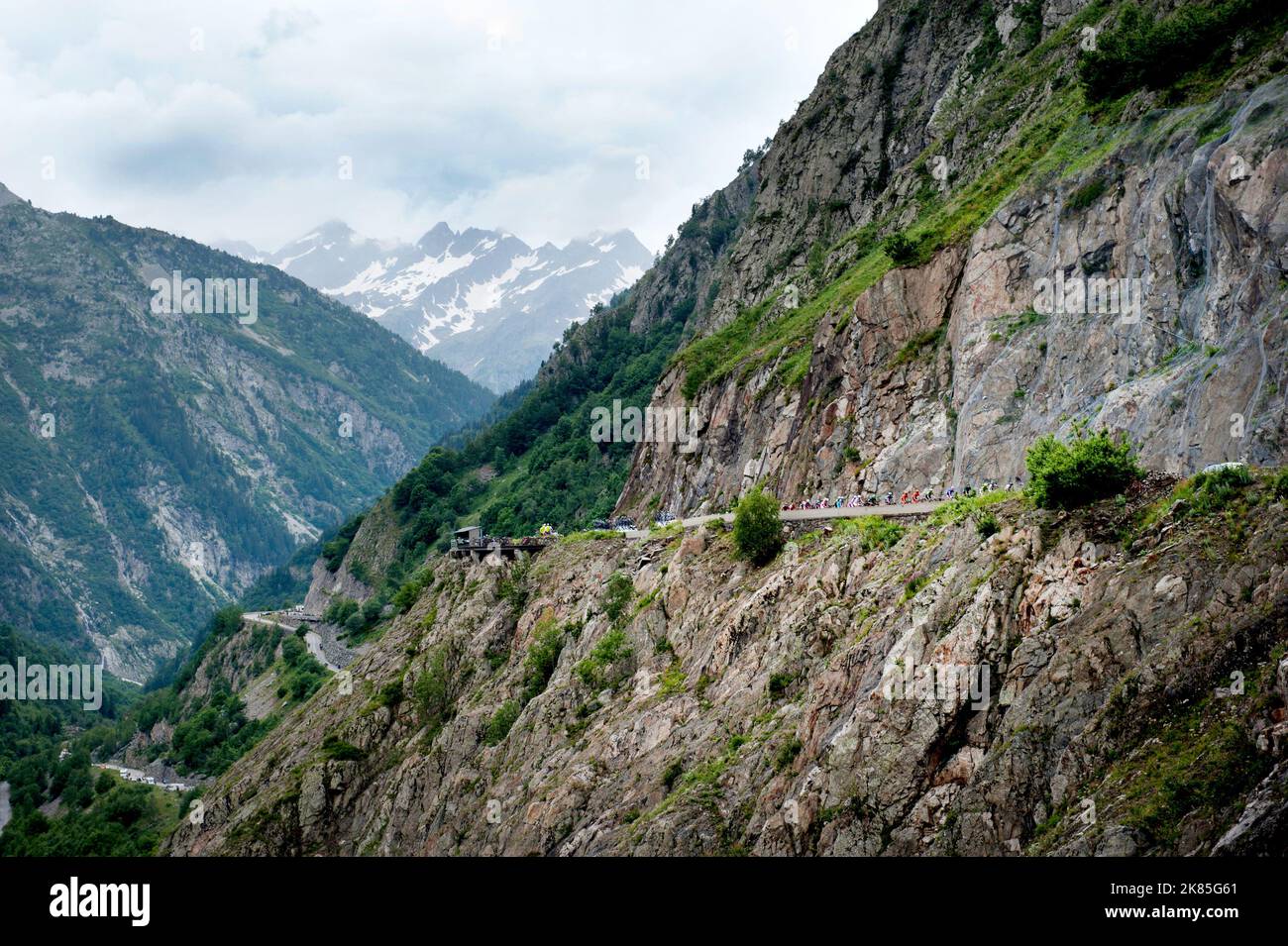 The peloton ride over the first mountain pass the Col du Glandon ...