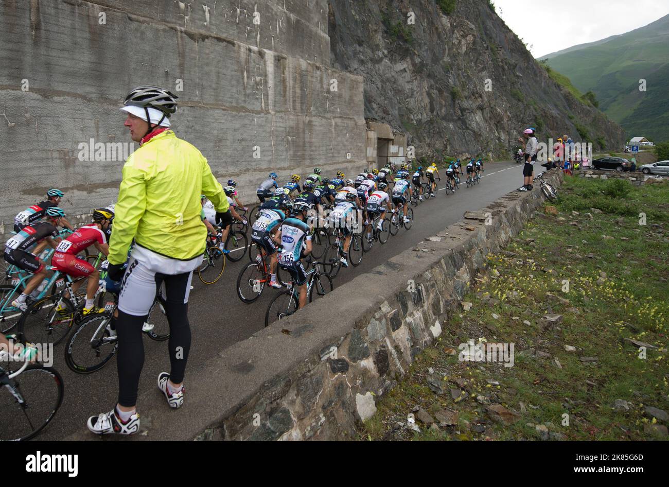 The peloton ride over the first mountain pass the Col du Glandon ...