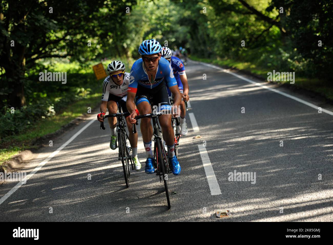 Jack Bauer (Garmin Sharp) rides ahead of Simon Yates and Yoann Offredo ...