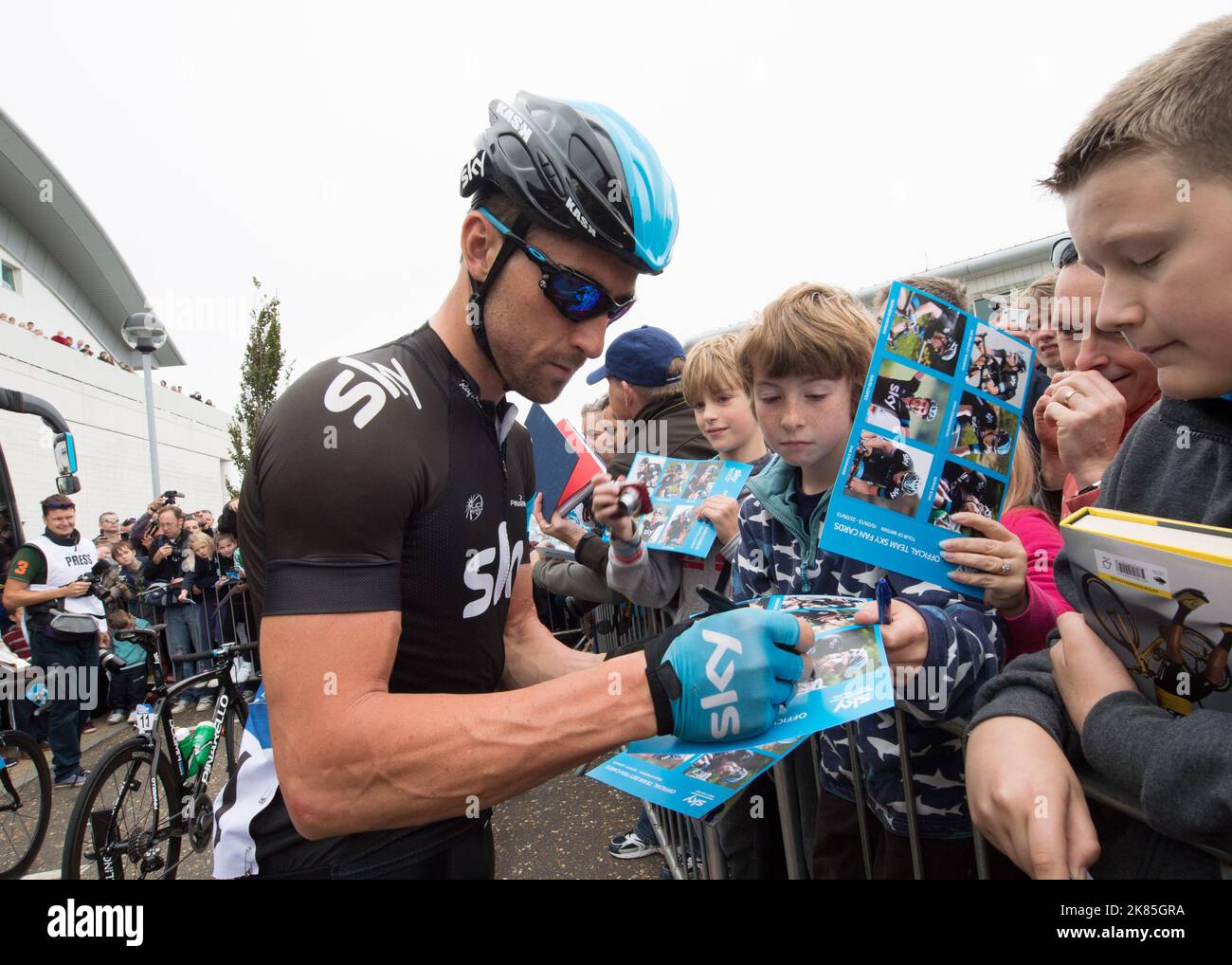 Bernhard Eisel, Team Sky Procycling signs autographs at the start of ...