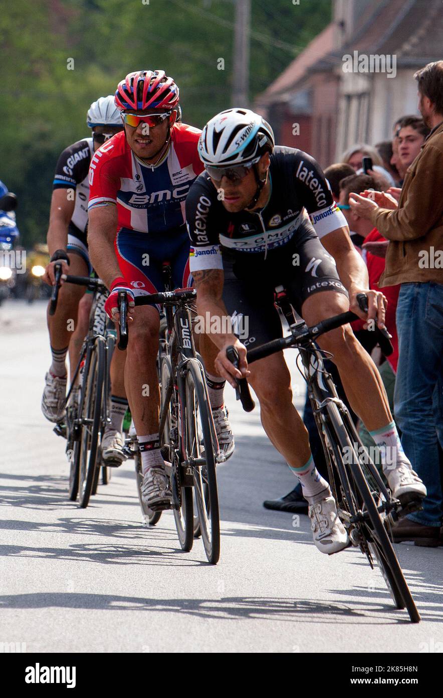BMC's Thor Hushovd covers Tom Boonens attacks as he sits on his wheel ...