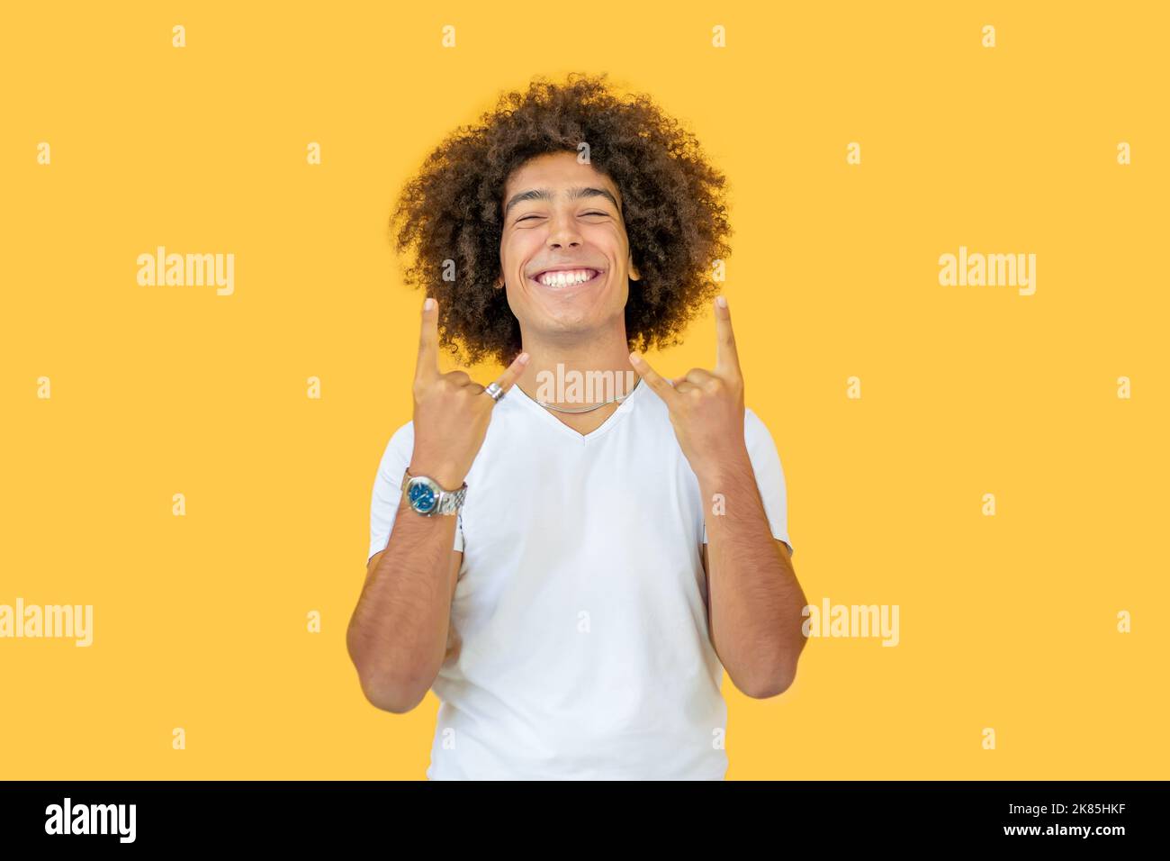 Smiling young men mixed race who rejoices in his success and victory ...